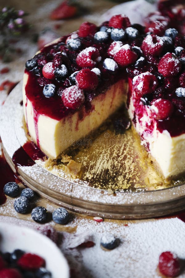 Mixed Berries Cheesecake with a Slice Cut Out Stock Photo - Image of ...