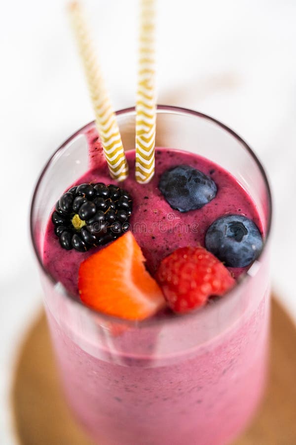 Mixed berry smoothie stock photo. Image of making, garnishes - 288374888