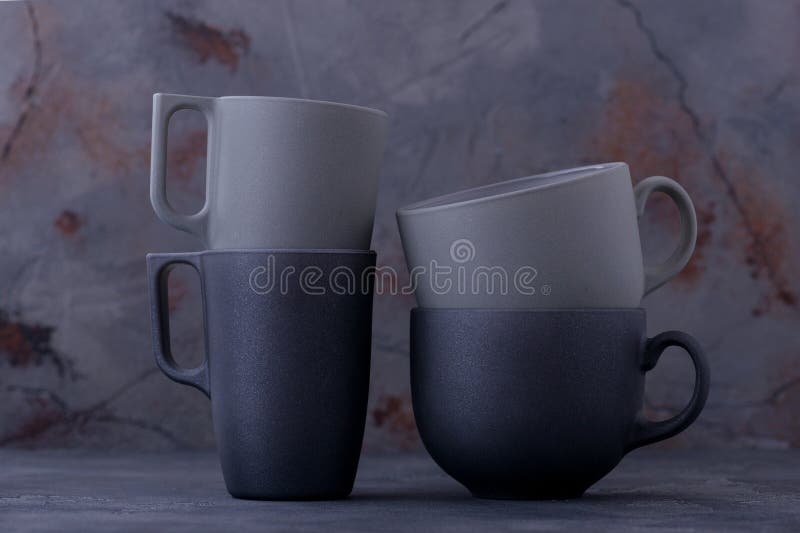 Mixed black and grey cups stock image. Image of plates - 103370203