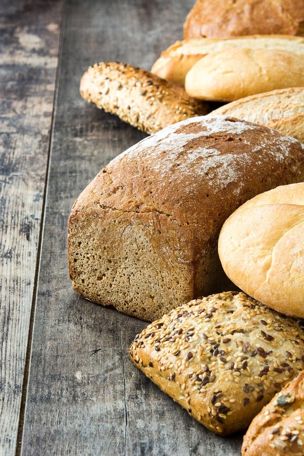 Mixed Breads on Wooden Table Stock Photo - Image of bread, mixed: 94254062