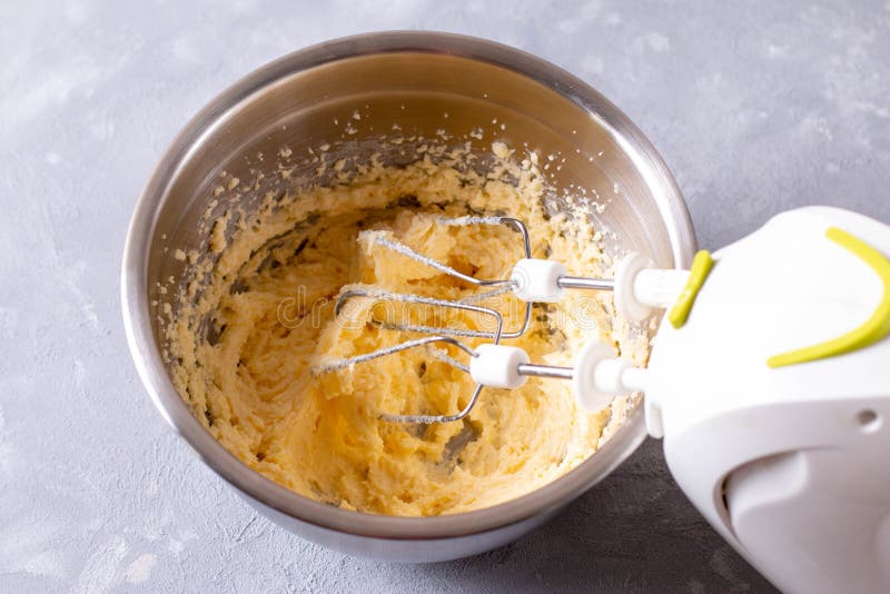 Mixing Butter, Sugar and Eggs in Bowl with Mixing Machine Stock Photo ...