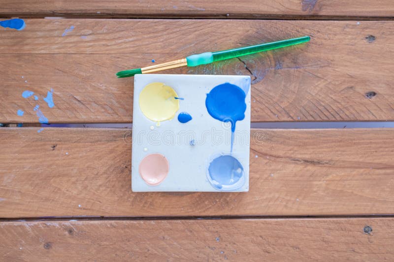 Mixed Colour Palette with a Brush on a Wooden Board Stock Image - Image ...