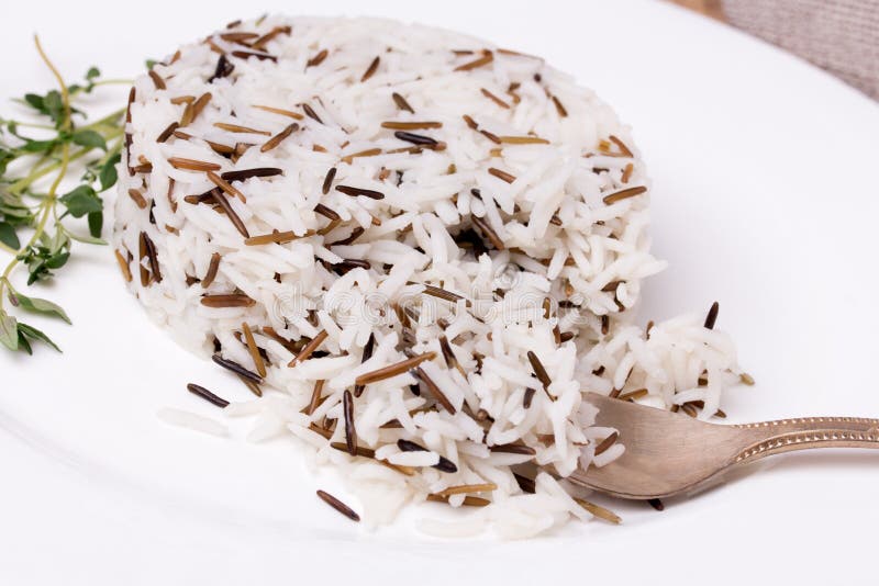 Mixed Cooked Rice with Thyme on White Plate Stock Image - Image of ...