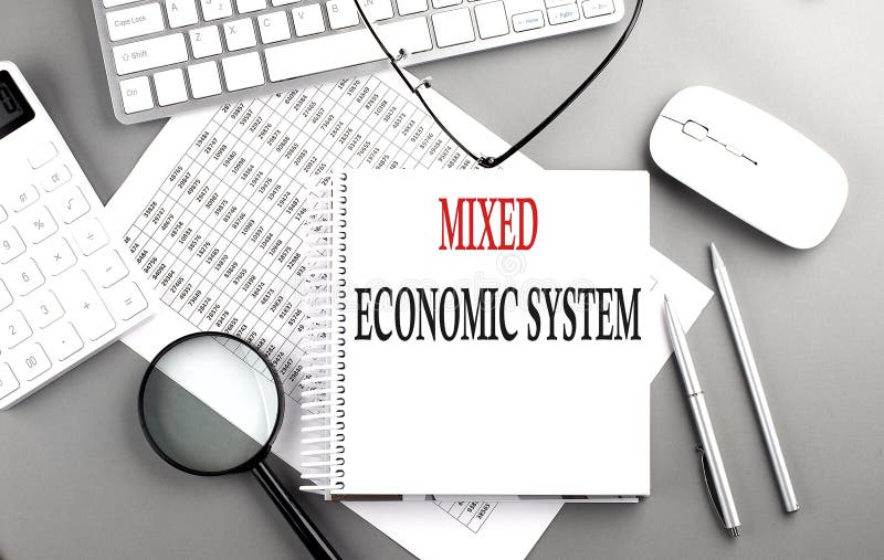 MIXED ECONOMIC SYSTEM Text on Notebook with Clipboard and Calculator on ...