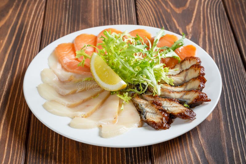 Mixed Fish Plate on Wooden Table. Cold Starter Stock Photo - Image of ...