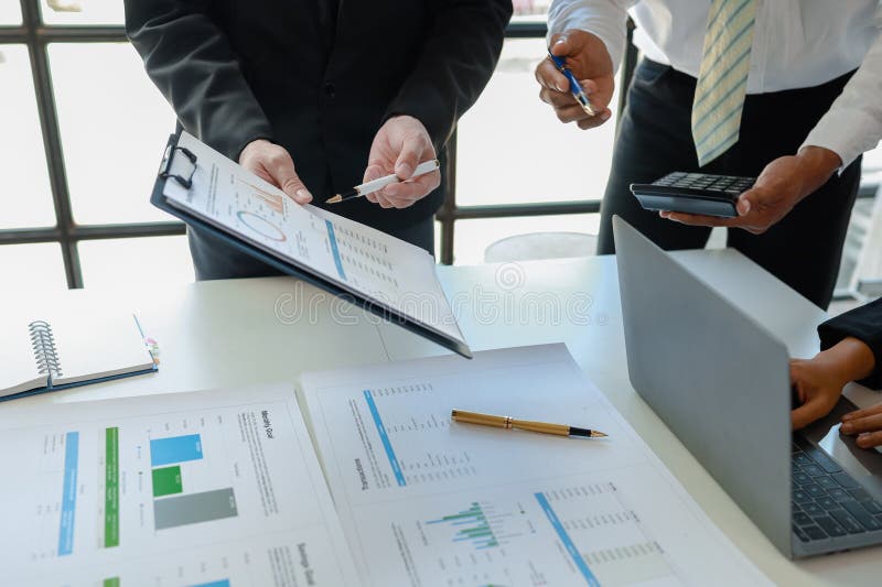 Mixed Group of Business People Sitting Around a Table and Working ...