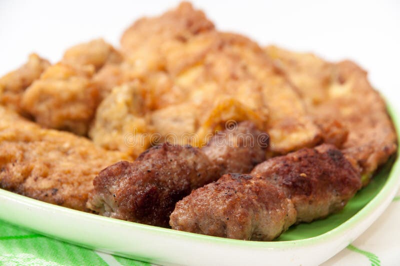 Mixed meat on a plate stock photo. Image of arranged - 51184804