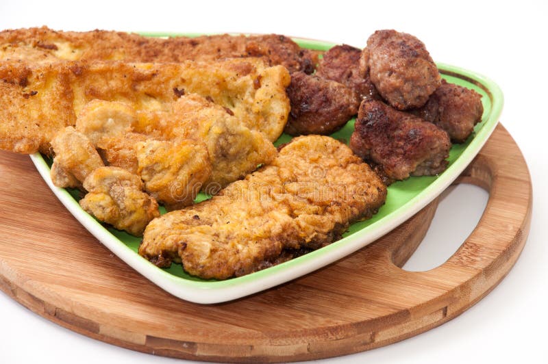 Mixed meat on a plate stock photo. Image of arranged - 51184804