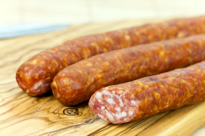 Mixed Meat-red Sausage on the Cutting Board Stock Photo - Image of ...