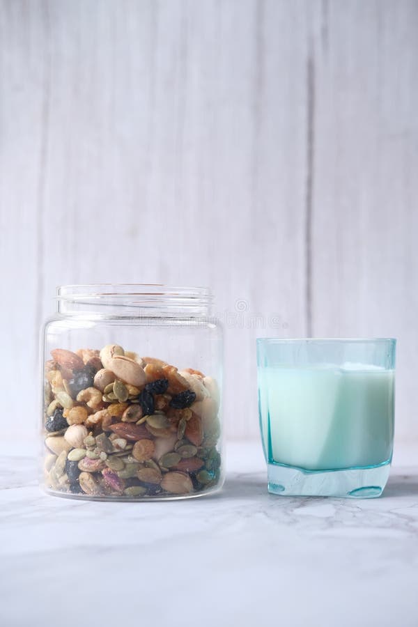 Mixed Nut , Milk on Table Against White Wall Stock Photo - Image of ...