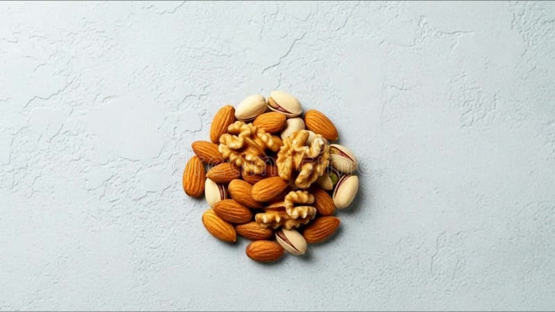 Mixed Nuts: Almonds, Walnuts, Pistachios on Grey Background Stock ...