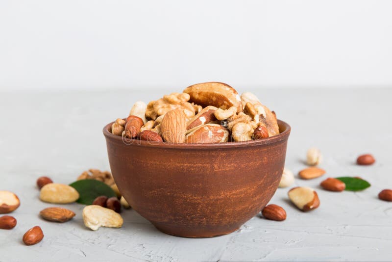 Mixed Nuts in Bowl. Mix of Various Nuts on Colored Background Stock ...