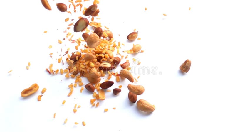 Mixed Nuts Falling on the White Paper on the Table Stock Video - Video ...