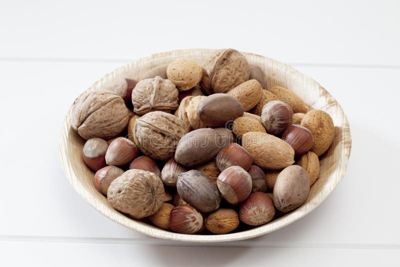 Mixed nuts on plate stock photo. Image of healthy, nutshell - 50486144