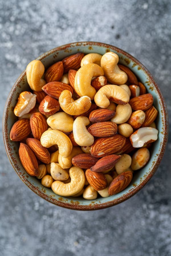 Mixed Nuts in a Rustic Bowl on a Textured Surface Showcasing Almonds ...