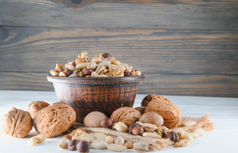 Mixed Nuts on Wood Floor. Organic and Fresh Nuts Stock Image - Image of ...
