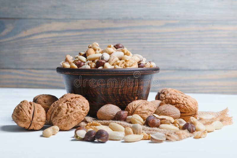 Mixed Nuts on Wood Floor. Organic and Fresh Nuts Stock Image - Image of ...