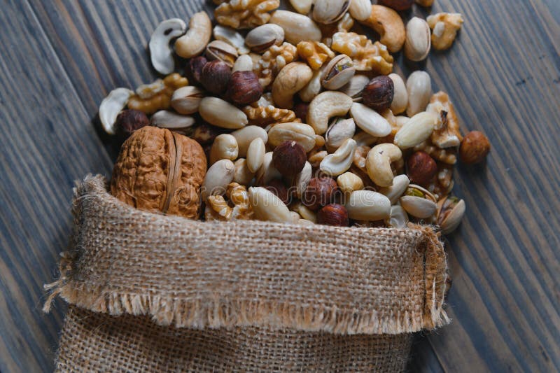 Mixed Nuts on Wood Floor. Organic and Fresh Nuts Stock Photo - Image of ...