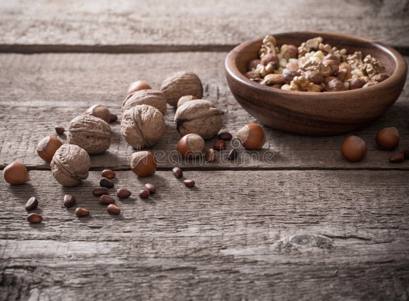 Mixed Nuts on Wooden Background Stock Photo - Image of background ...