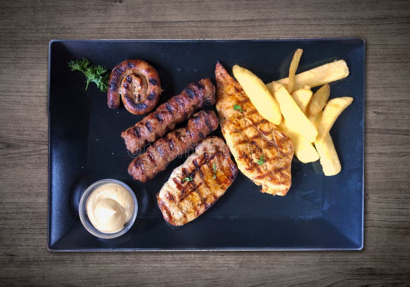 Mixed Plate Chicken Meat, Pork and Calf with Chips Stock Image - Image ...