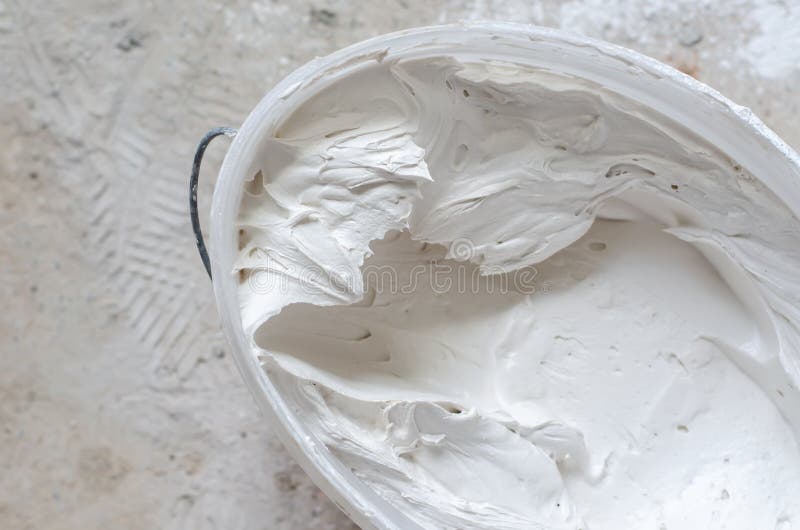 Mixing Putty Solution in a Pail. Construction Works Stock Photo - Image ...