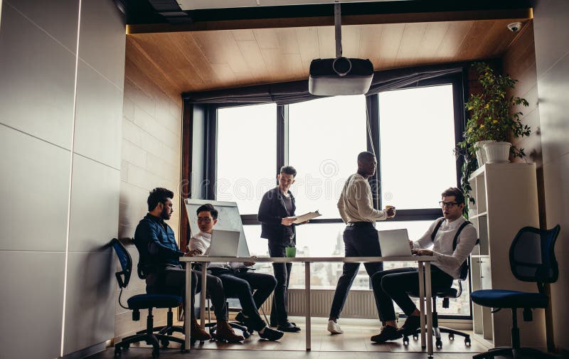 Business Men in an Open Space Office Interior with a Panoramic Window ...