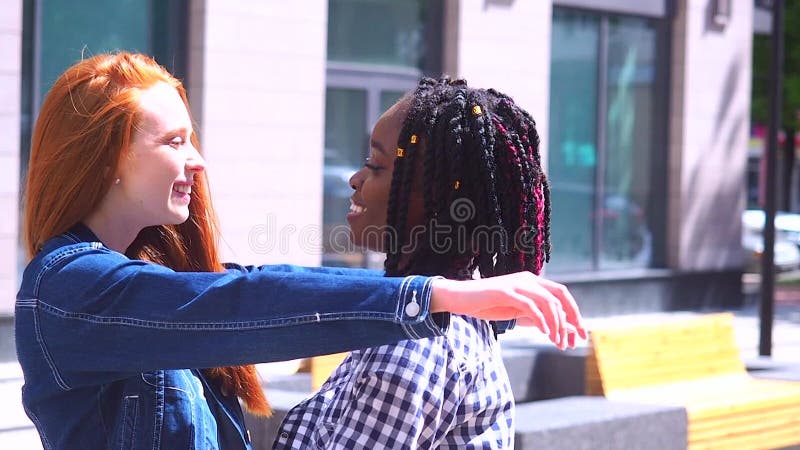 Mixed Race Friends Meet and Hug in Down Town Stock Video - Video of ...