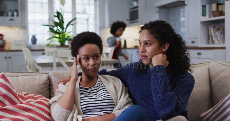 Mixed Race Lesbian Couple Sitting On Couch And Stock Video Video Of