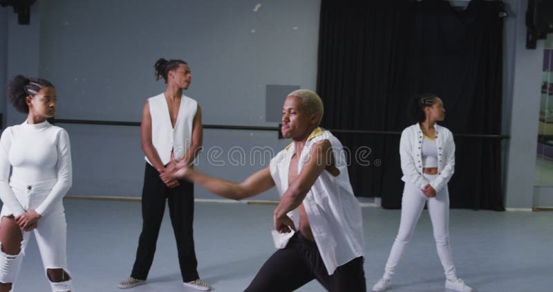 Mixed Race Modern Male Dancer Standing in Front of a Group of Male and ...