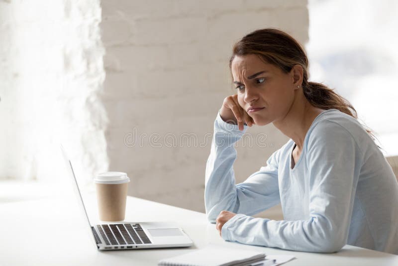 Bored Young Woman Looking at Computer Screen Stock Image - Image of ...