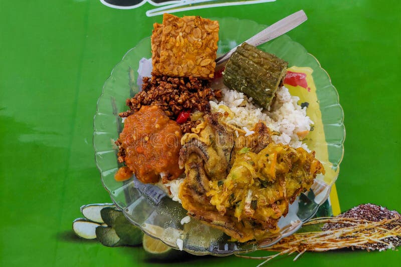 Mixed Rice and Side Dishes are Plated on a Green Table Stock Photo ...