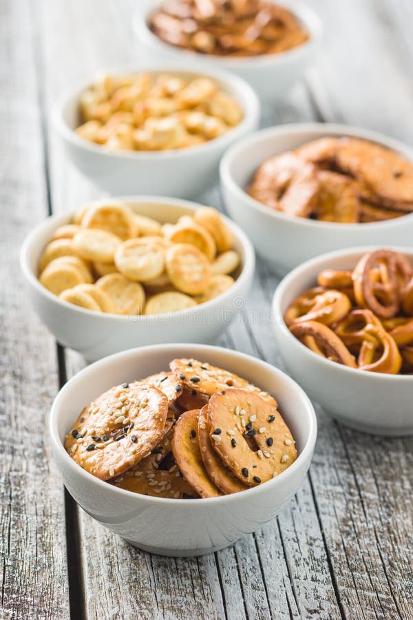 Mixed Salty Snack Crackers and Pretzels. Stock Photo - Image of heap ...