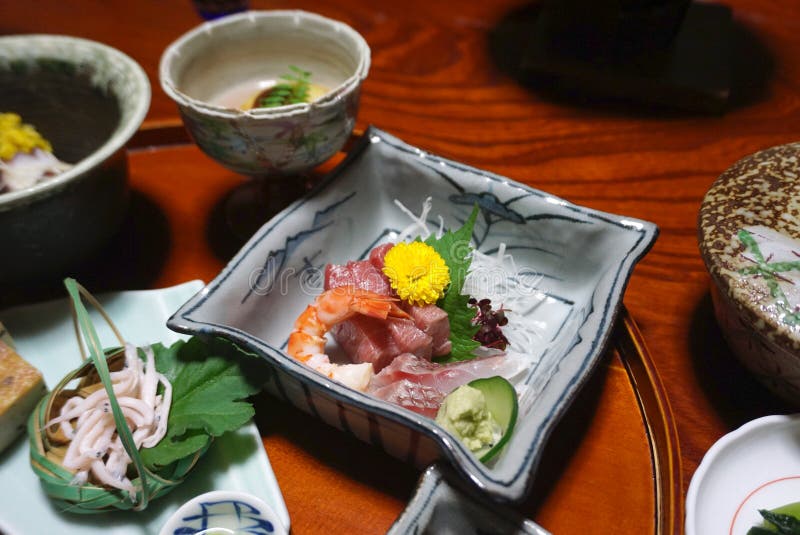 Mixed Sashimi with Yellow Flower on the Bowl in Japanese Set Stock ...