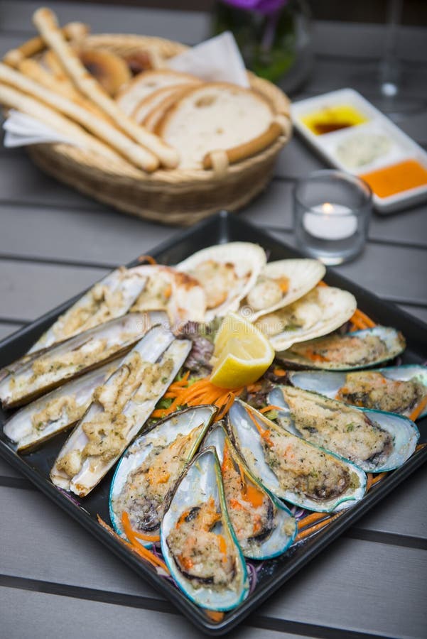 Mixed Shell Bake for Dinner Stock Photo - Image of black, lime: 59524390