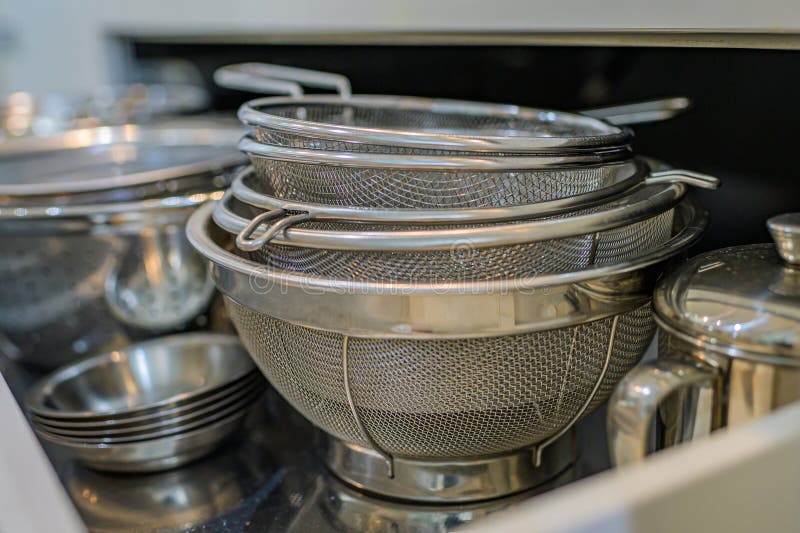 A Mixed Stack of Stainless Steel Strainers and Other Utensils. Stock ...