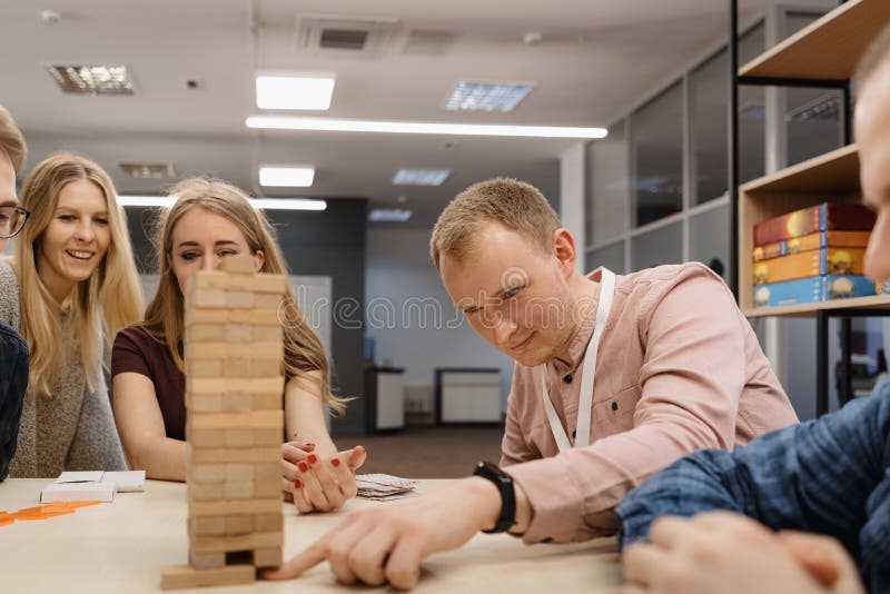 Mixed Team Playing Blocks Wood Game in the Office Stock Photo - Image ...