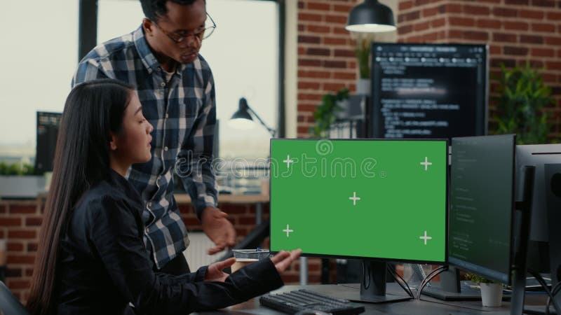 Mixed Team Of Programmers Analyzing Source Code Looking At Green Screen Chroma Key Mockup Stock
