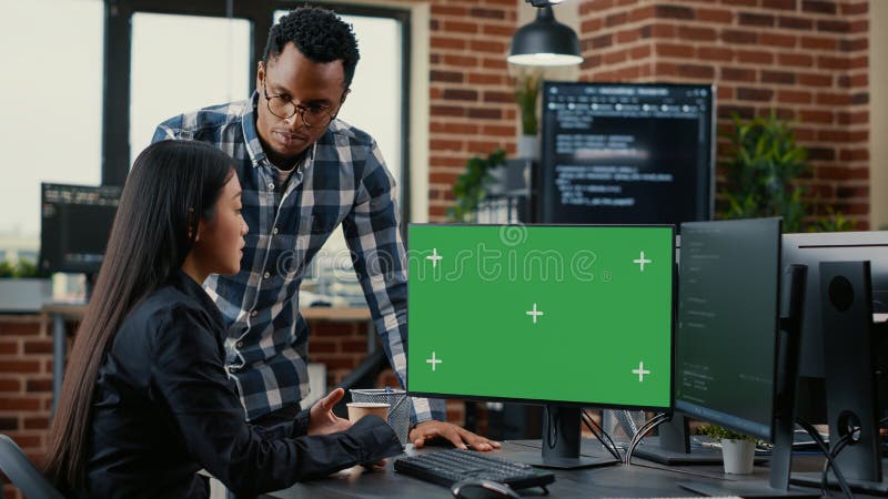 Mixed Team Of Programmers Analyzing Source Code Looking At Green Screen Chroma Key Mockup Stock