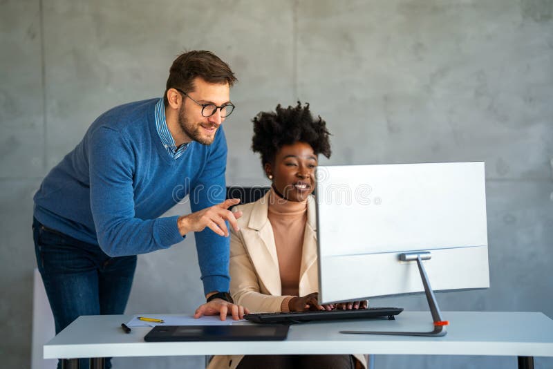 Mixed Team of Software Engineers Brainstorming Ideas. Diverse App Developers Collaborating As ...