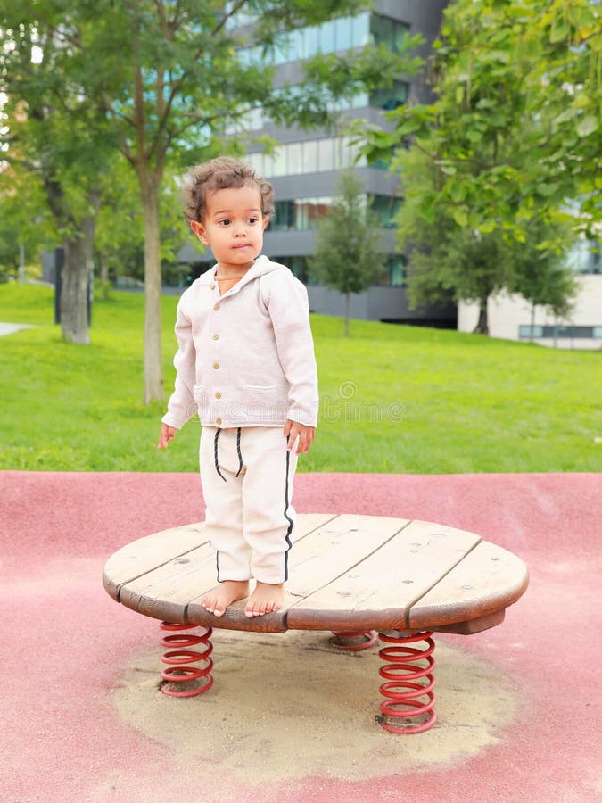 Toddler Boy Playing on Playground - Standing on Spring Platform Stock ...