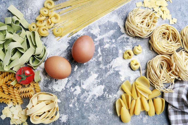 Mixed Types and Shapes of Italian Pasta on Grey Stone, Background Stock ...