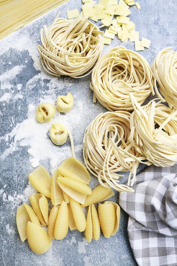 Mixed Types and Shapes of Italian Pasta on Grey Stone, Background Stock ...