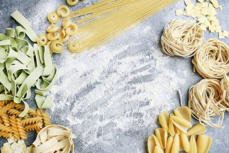 Mixed Types and Shapes of Italian Pasta on Grey Stone Background Stock ...