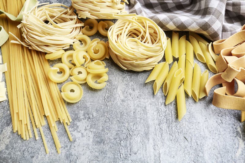 Mixed Types and Shapes of Italian Pasta on Grey Stone, Background Stock ...