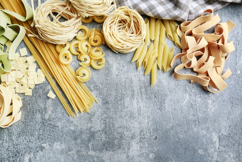 Mixed Types and Shapes of Italian Pasta on Grey Stone Background Stock ...