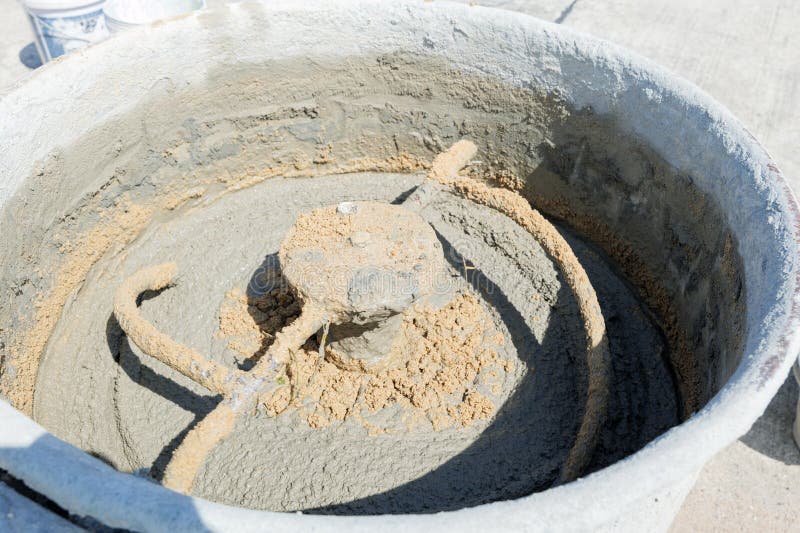 Cement Mixer with Gray Mortar and Tan Sand Churning Inside. Blades ...