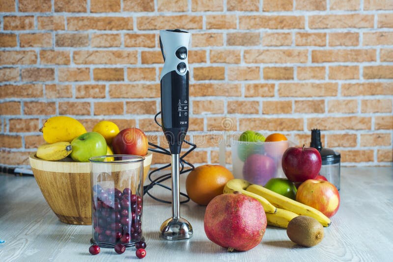 Mixer and fruit on table stock image. Image of lemon - 83791473