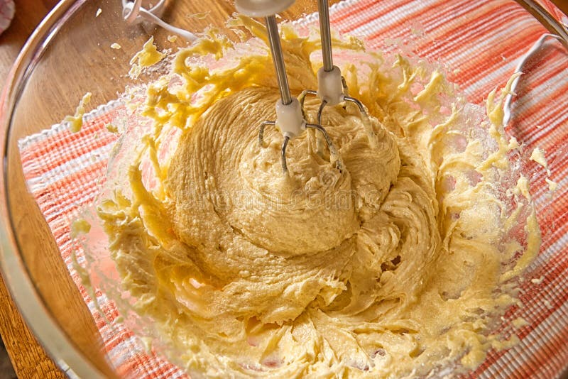 Mixing a cake mixture. stock image. Image of beating - 334799141