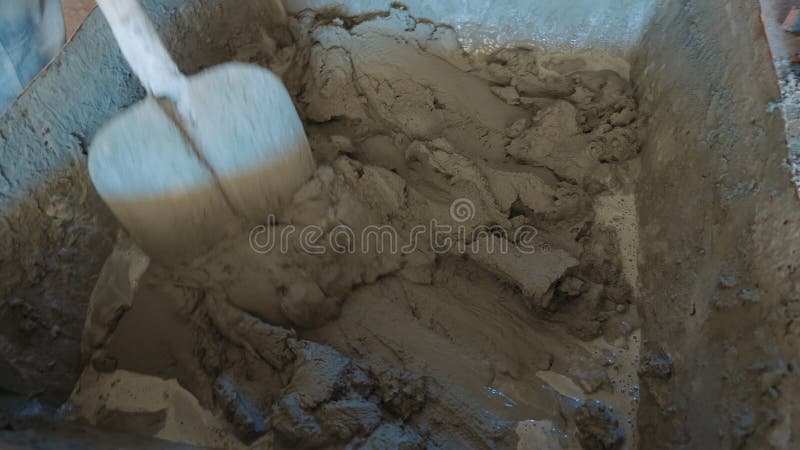 Mixing Cement for Construction Project, Close-up of Cement Being Mixed ...