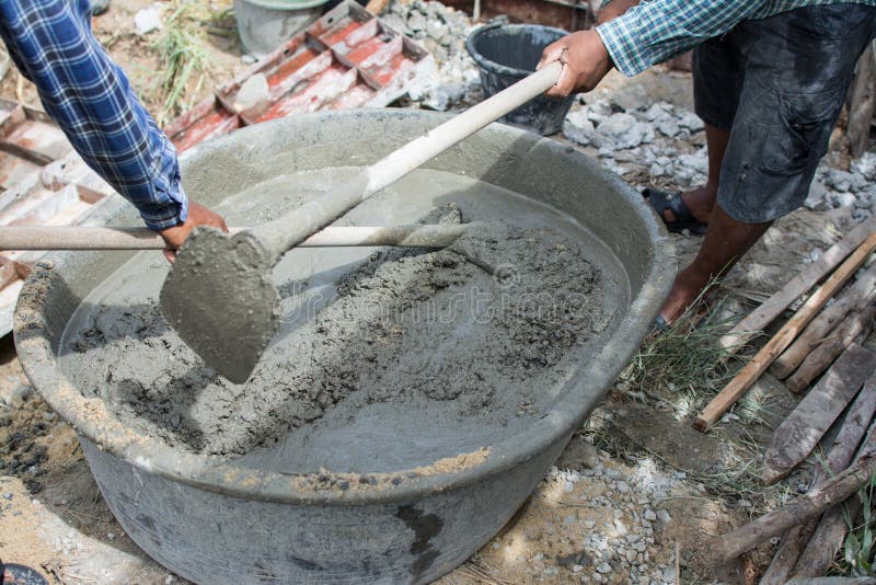 Mixing a cement in salver stock photo. Image of excavation - 122532364